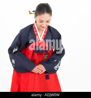 A Korean woman wearing Hanboek is bowing gracefully Stock Photo - Alamy
