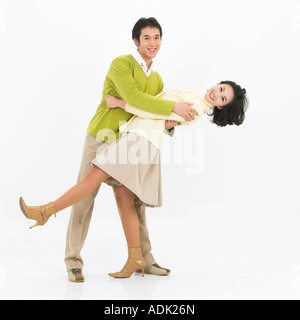 A couple dancing happily Stock Photo - Alamy