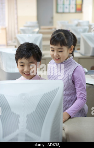 Students learn in a computer lab at a school in Dar es Salaam, Tanzania ...