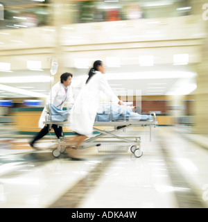 medicine a doctor moving an emergent patient Stock Photo - Alamy