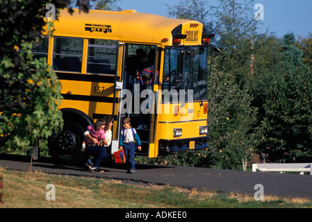 Children getting off school bus Stock Photo - Alamy