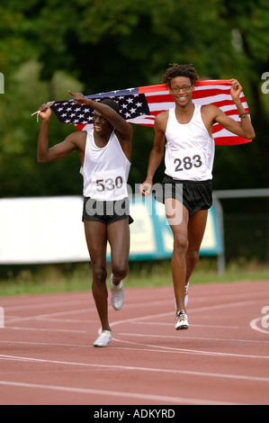 Male Runners Carrying US Flag Stock Photo - Alamy