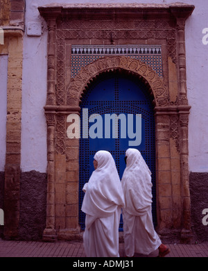 People walk past a summer clothes shop at Eminonu commercial district ...