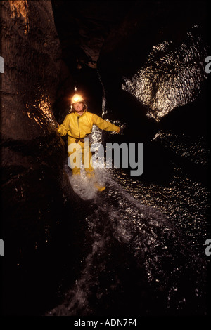 Female caver in a streamway in a South Wales cave UK Stock Photo - Alamy
