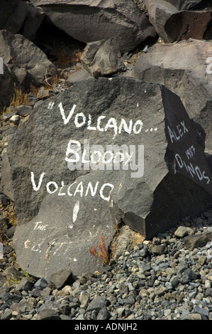 Rock on Nea Kameni volcanic volcano island with cruise ship liners and ...
