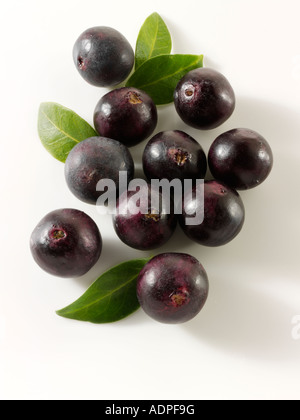 Acai berries, whole and cut, on a white background Stock Photo - Alamy
