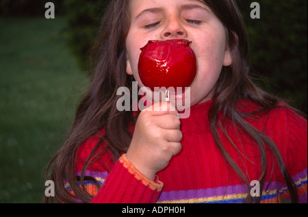 Child Eating Toffee Apple 6 Year Old Stock Photo - Alamy