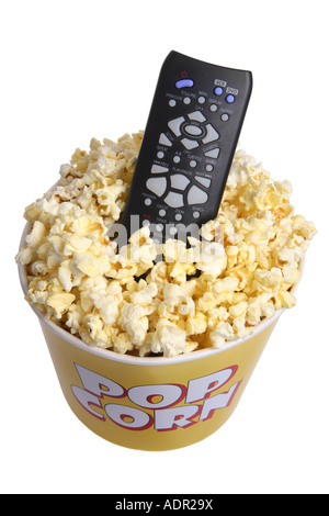 Modern popcorn machine and TV remote on coffee table in living room ...