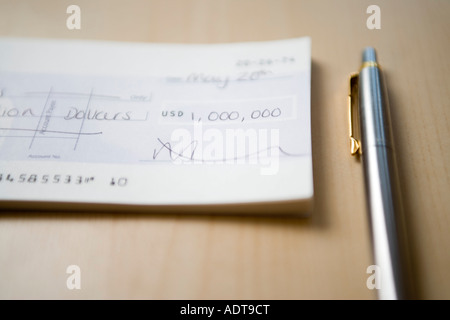 One million dollars cheque and a pen Stock Photo - Alamy
