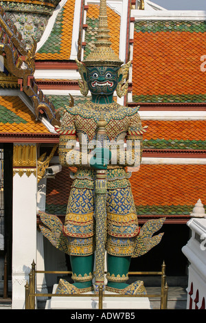 Large green guardian statue stands at an entrance to the Grand Palace ...