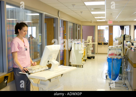 Nurse Enters Data in Computer in Hospital Operating Room Stock Photo ...