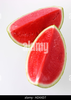 Fresh seedless wedge cut watermelon and one watermelon slice isolated ...