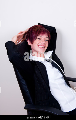 relaxed worker laying on his chair while working Stock Photo - Alamy