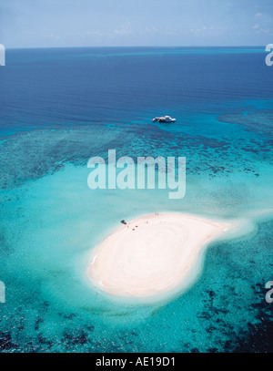 Aerial of tourist vessel visiting a coral sand cay on the Great Barrier ...