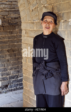 Woman standing in chamber inside a Great Wall watch tower Simatai Great ...
