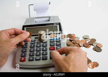 Counting Changes with Calculator Stock Photo - Alamy
