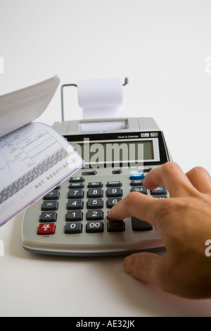 Handheld Calculator and Checkbook Stock Photo - Alamy