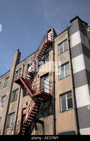 Outside metal fire escape stairs. Metal fire escape stairs mounted on ...