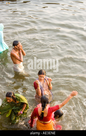Photograph of Indian men bathing in a river in Varanasi India Stock ...