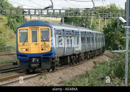 Thameslink class 319 train travelling through the british countryside ...