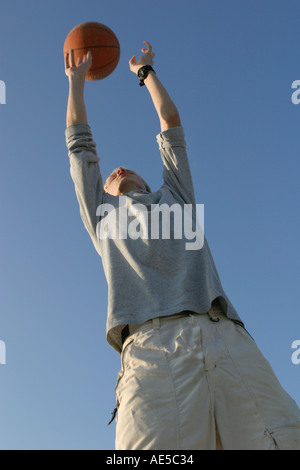 Boy Shooting Baskets Stock Photo - Alamy