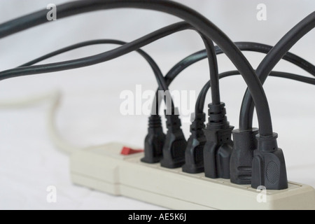 Electrical power strip overloaded with many plugs Stock Photo - Alamy