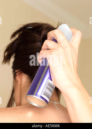 Young Women Applying Hair Spray Model Released Stock Photo - Alamy