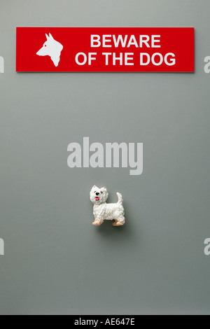 Painted red warning sign at the bark of a trunk (letter A recognizable ...