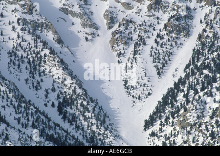 Avalanche chute snow gully on mountain in winter near Lone Pine Eastern ...