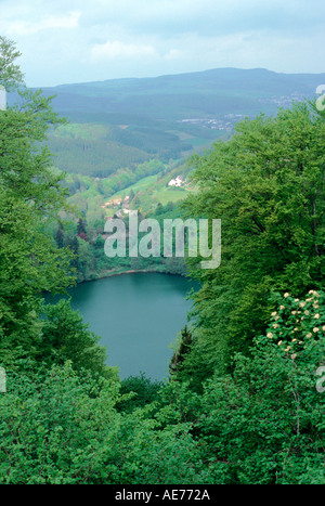 The Gemuendener Maar volcano lake in the Eifel, Germany near Daun in ...