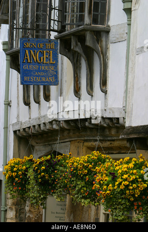 Traditional hanging pub sign at the The Angel Inn, High Street, Wooler ...