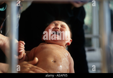 A Chinese baby crying while having a shower Stock Photo - Alamy
