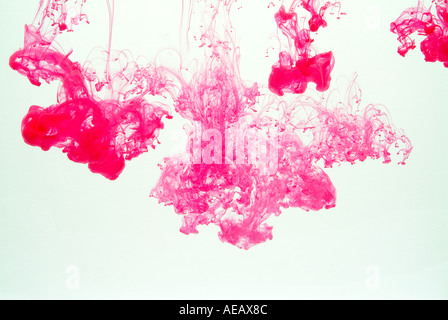 Coloured ink in water creating graphic swirling patterns Stock Photo ...