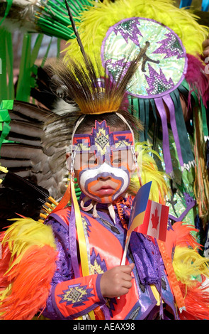 YOUNG CREE FIRST NATION BOY WITH FACE PAINTED IN TRADITIONAL COSTUME ...