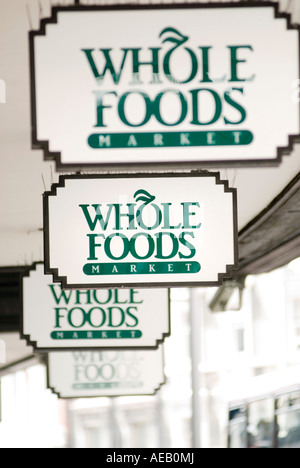 Whole Foods Market sign on side of mixed-use building against clear ...