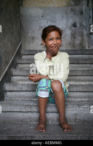 Roma gypsy children sitting in a box at Share, a slum next to a rubbish ...