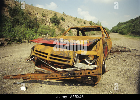 Old yellow wrecked car in vintage style. Abandoned rusty yellow car ...