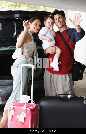 Caucasian father waving goodbye to his family before going to work ...