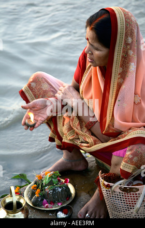 Woman praying. Shivala Ghat. Ganges river. Varanasi. India Stock Photo ...