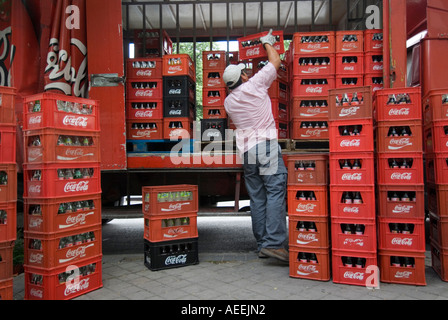 coca-Cola truck unloading, workers delivering Coca Cola to the retail ...