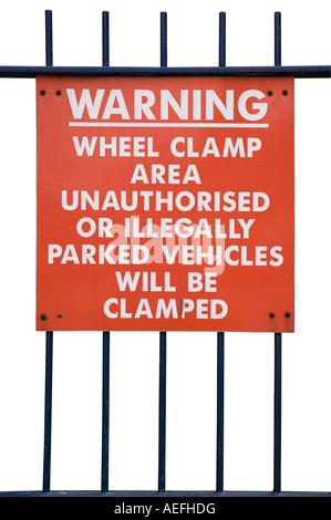 A wheel clamping warning sign on a wall in . Photo by Gordon Stock ...