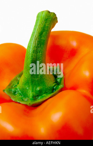 Fresh orange paprika on red backround - Top view Stock Photo - Alamy