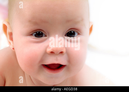 Baby chubby cute cheeky rosy smile closeup close up close up curious ...
