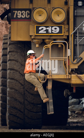 Big dump truck and female driver at Mt Newman iron ore mine Western ...
