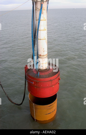 monopile being piled into the seabed using hydraulic hammer at the ...