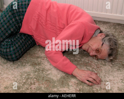 elderly woman fallen over or collapsed on floor Stock Photo - Alamy