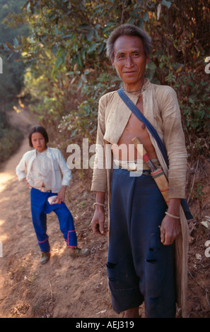 Smiling man from the Lahu people, hill tribe, ethnic minority, carrying ...