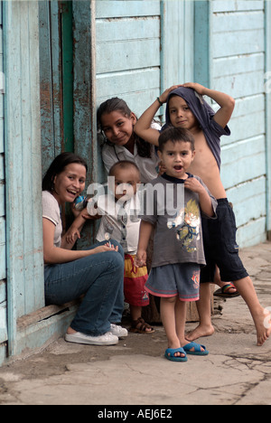 Costa Rican family in front of their house Stock Photo - Alamy