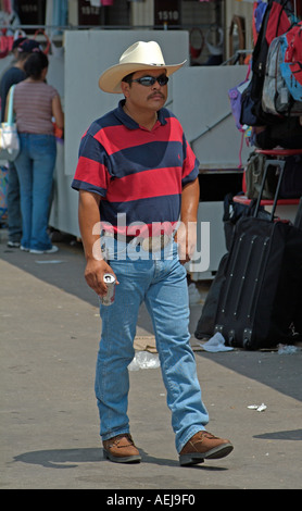 Texan man walking in the street Stock Photo - Alamy
