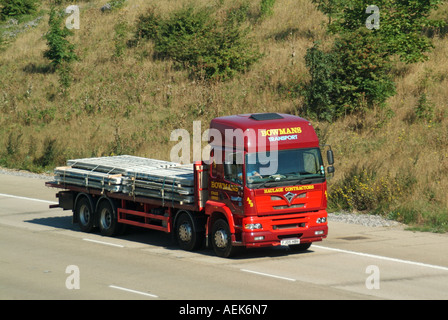 M25 motorway flat back lorry travelling empty Stock Photo - Alamy